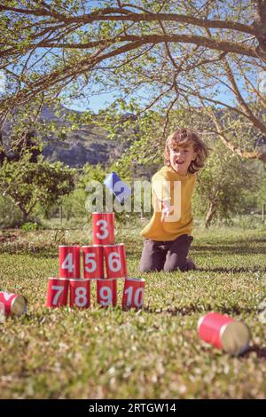 stacked tin can pyramid for can knockdown game at funfair Stock Photo ...