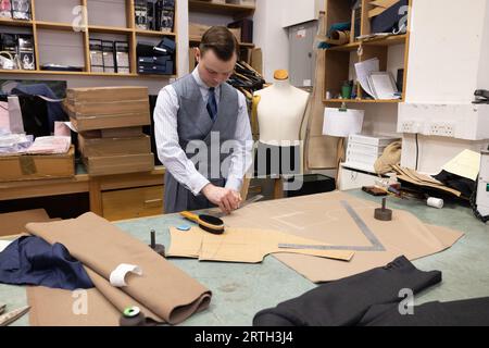 Master Cutter at Dege & Skinner, family-owned tailoring house, Savile ...