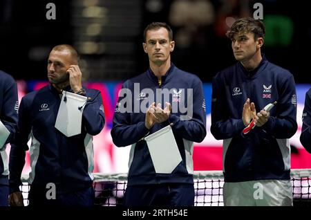 Jack Draper, of Great Britain, left, shakes hands with Holger Rune, of Denmark, after the final ...