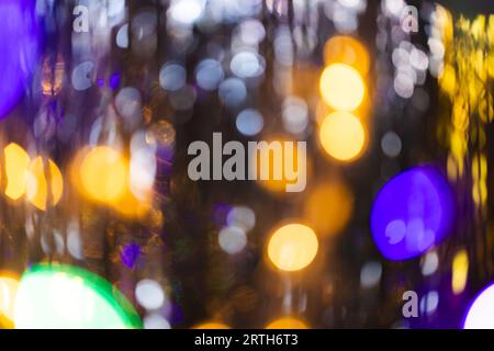 Multiple yellow and blue bokeh lights with copy space on dark ...