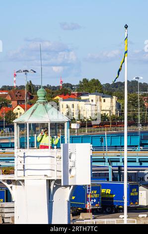 Swedish humour, a mannequin in a dockworker's work clothes keeps a ...