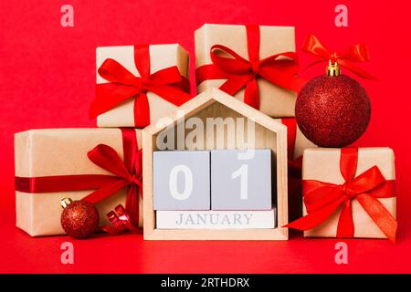1 january. Christmas composition on colored background with a wooden ...