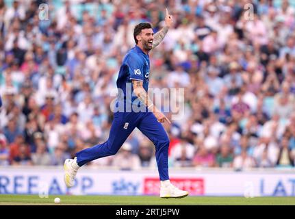 Reece Topley of England celebrates taking the wicket of Virat Kohli of ...
