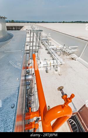 Orange piping is prominent on the side of a commercial ammonia-cycle ...