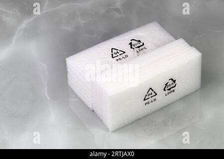 Plastic packaging symbols: warning to keep bags away from children, recycle icon, recyclable ...