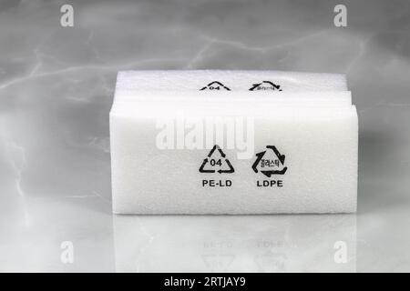 Plastic packaging symbols: warning to keep bags away from children, recycle icon, recyclable ...