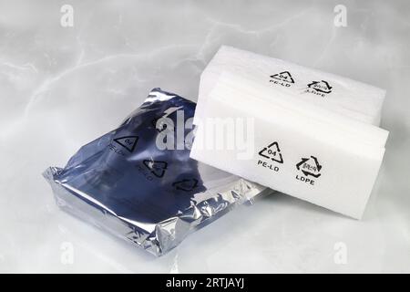 Plastic packaging symbols: warning to keep bags away from children, recycle icon, recyclable ...