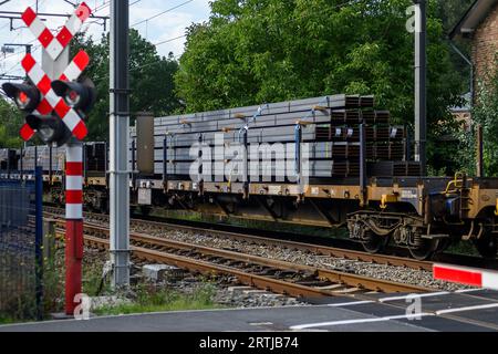 Moving freight train with carriage loaded with metal powder in the ...