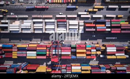 Stacked cargo containers top down aerial view. Containers at logistics ...