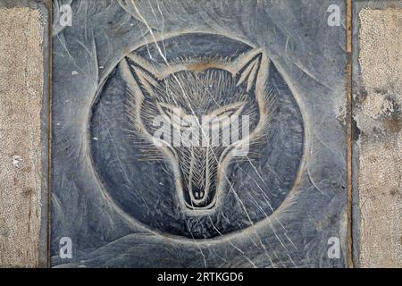 Wolf head sculpture on the ground, North China Stock Photo - Alamy