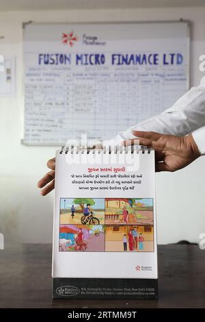 Microfinance institution flip charts in Sagbara, Gujarat, India Stock ...