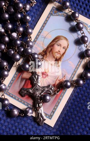 Jesus Christ. His wounded hand points to the symbolic sacred heart ...