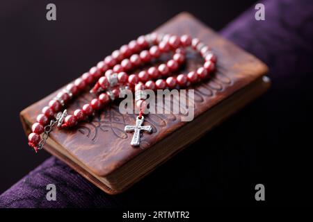Old Roman Misel and catholic rosary beads. Religious symbol Stock Photo ...