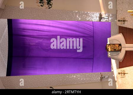 Lent and Holy Week - sacred image covered with purple fabric and symbol ...