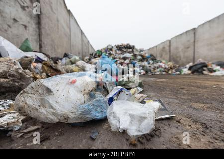 Landfill site, a pile of stinky different junk disposal in the concrete ...
