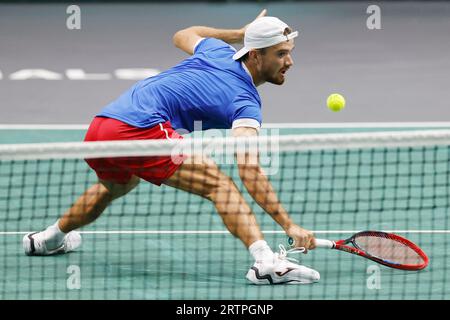 Tomas Machac of the Czech Republic, returns to Brandon Nakashima, of ...