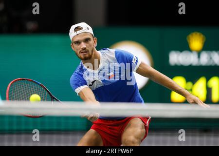 Tomáš Machac of Czech Republic returns to Damir Dzumhur of Bosnia and ...