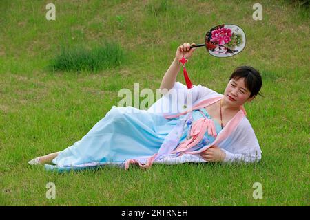 Beautiful Korean woman dressed Hanbok, Korean traditional dress, in ...