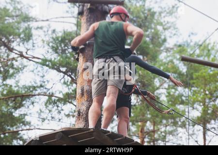 View of high ropes course, process of climbing in amusement acitivity ...