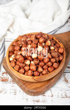 Hazelnuts in the bowl on the wood background ready for eat Stock Photo ...