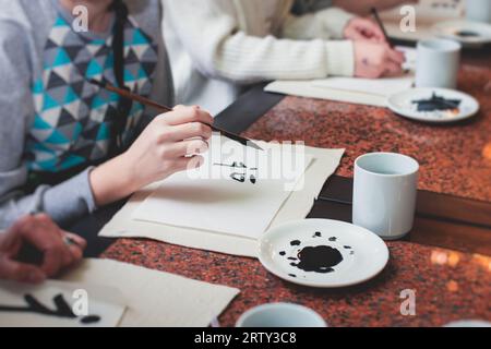 Chinese calligraphy lesson, group of kids learn and practicing ...