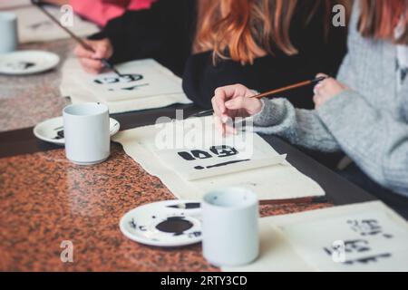 Chinese calligraphy lesson, group of kids learn and practicing ...