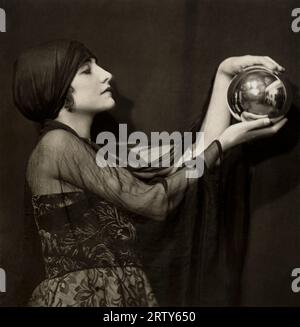 A magician holding in hands a white magic book. Wizard table Stock ...