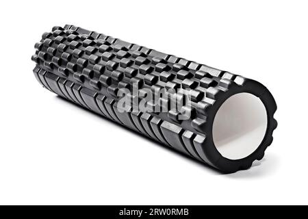 A black bumpy foam massage roller. Foam rolling is a self-myofascial ...