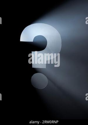 Question Mark. Hole cut in cardboard, smoke machine and spotlight. The ...