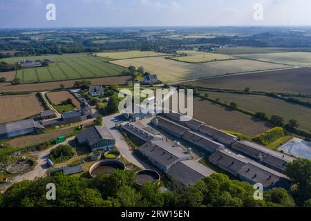 Aerial view of pig farm with closed stables and manure reservoirs ...
