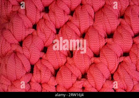 Braided background made of crimson, pink, dense thread. Beautiful ...