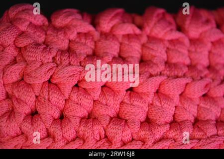 Braided background made of crimson, pink, dense thread. Beautiful ...