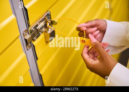 African American female touches a sealed lock Stock Photo - Alamy