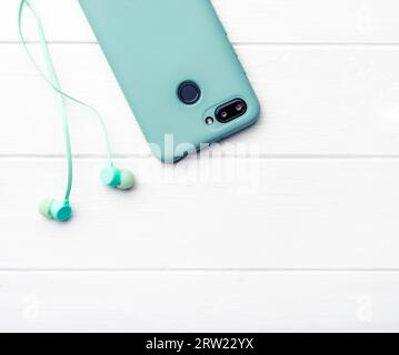 Digital telephone with protection and headphones at the table, close-up ...