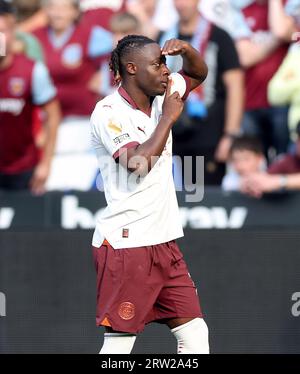 Manchester City's Jeremy Doku celebrates scoring his side's 4th goal ...