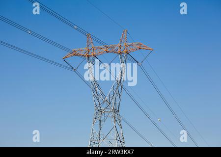 Symmetrical high voltage electricity poles in Turkey Stock Photo - Alamy