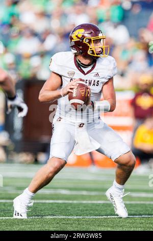 Central Michigan quarterback Jase Bauer (8) makes a pass under pressure ...