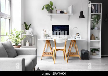 Interior of office with programmer's workplace and sofa Stock Photo - Alamy