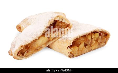Delicious cut strudel with apples, nuts and raisins isolated on white ...