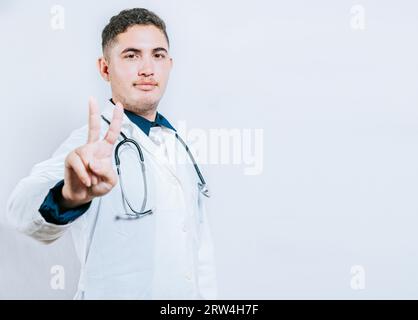 Young doctor counting number 5 on isolated background. Doctor counting ...
