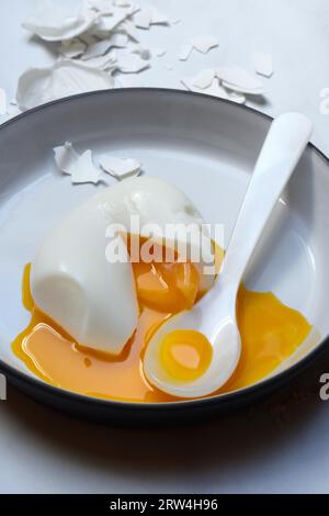 Soft-boiled egg with a spoon Stock Photo - Alamy