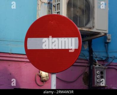 No entry sign board pole under blue sky Stock Photo - Alamy