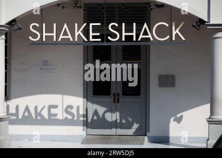 Shake Shack establishment signage. The afternoon lighting gives the ...