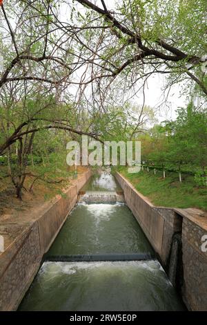 Rock lined canal in a park, Beijing Stock Photo - Alamy