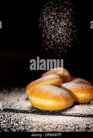 German Krapfen with drizzling glazed sprinkles in black elegant ...