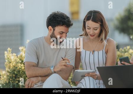 Two engineers discussing project documentation Stock Photo - Alamy