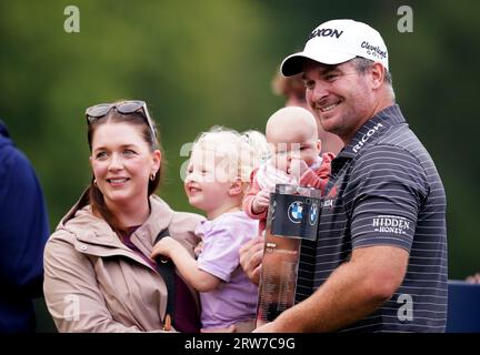 Ryan Fox poses with the trophy with wife Anneke Ryff and daughters ...