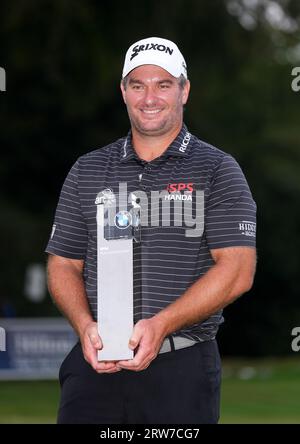 Ryan Fox poses with the championship trophy along with his wife Anneke ...