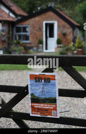 A resident displays a ‘Say No' poster on their front gate in the ...