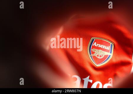 A photo of the red and white Arsenal Football Club t-shirt and badge ...